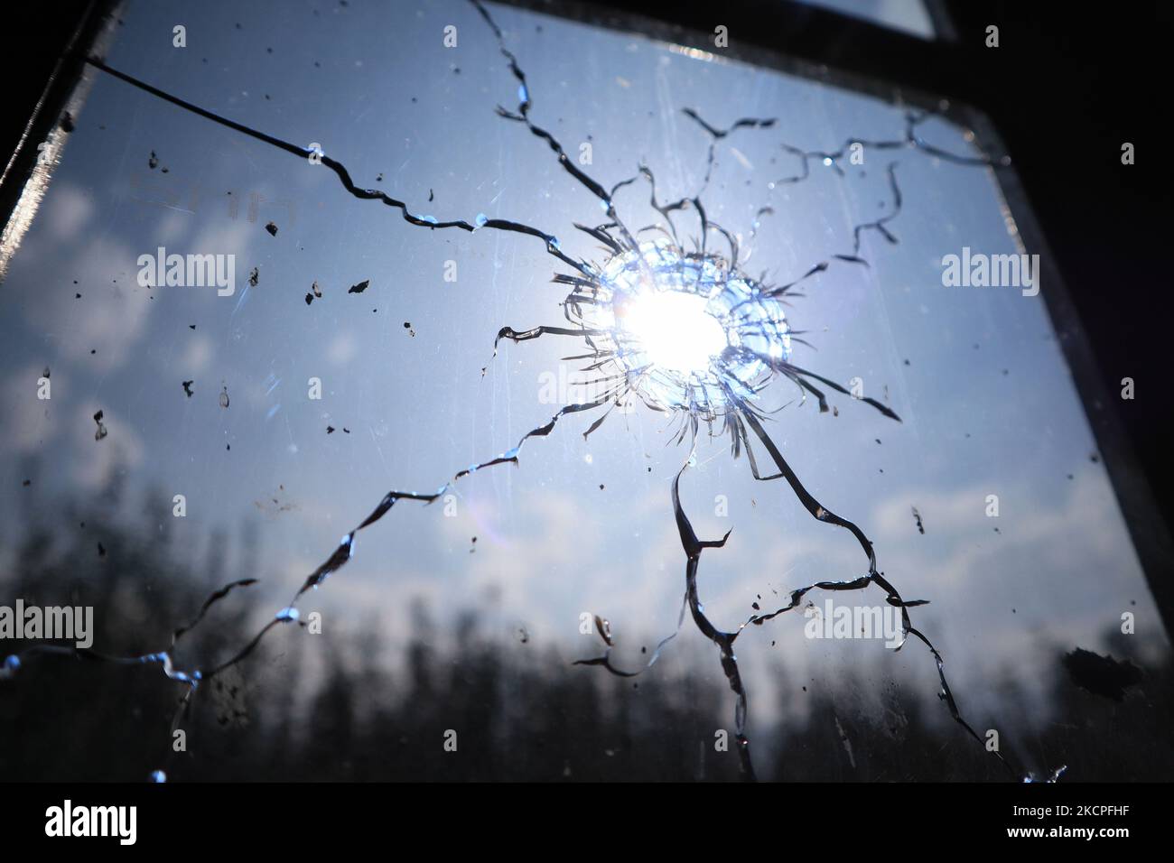 Bullet-ridden window pane of a residential house where two militants ...