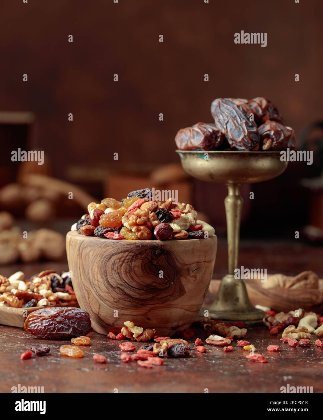 Various dried fruits and nuts on a kitchen table. Copy space Stock ...