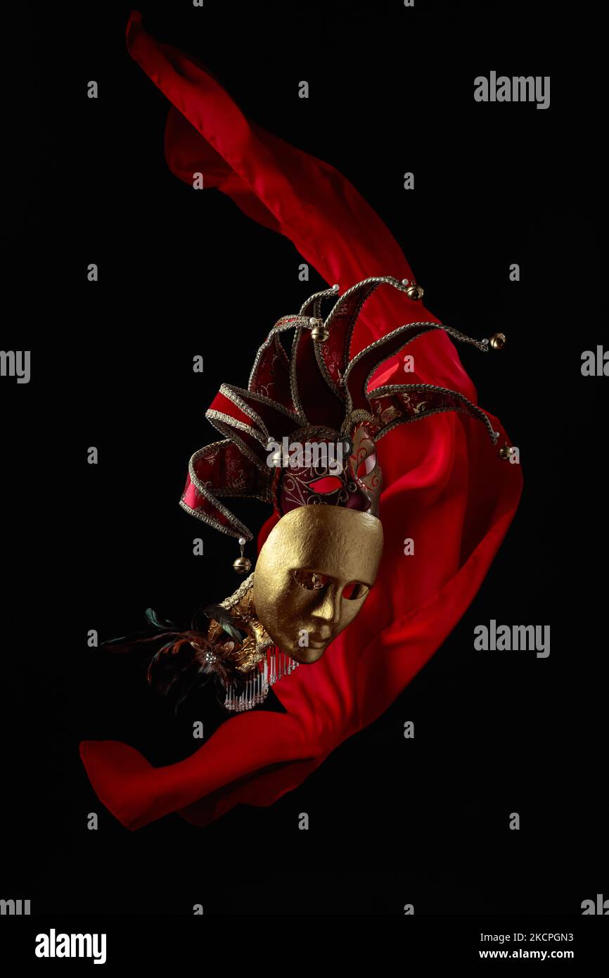 Old carnival masks on a black background with flutters red cloth Stock ...