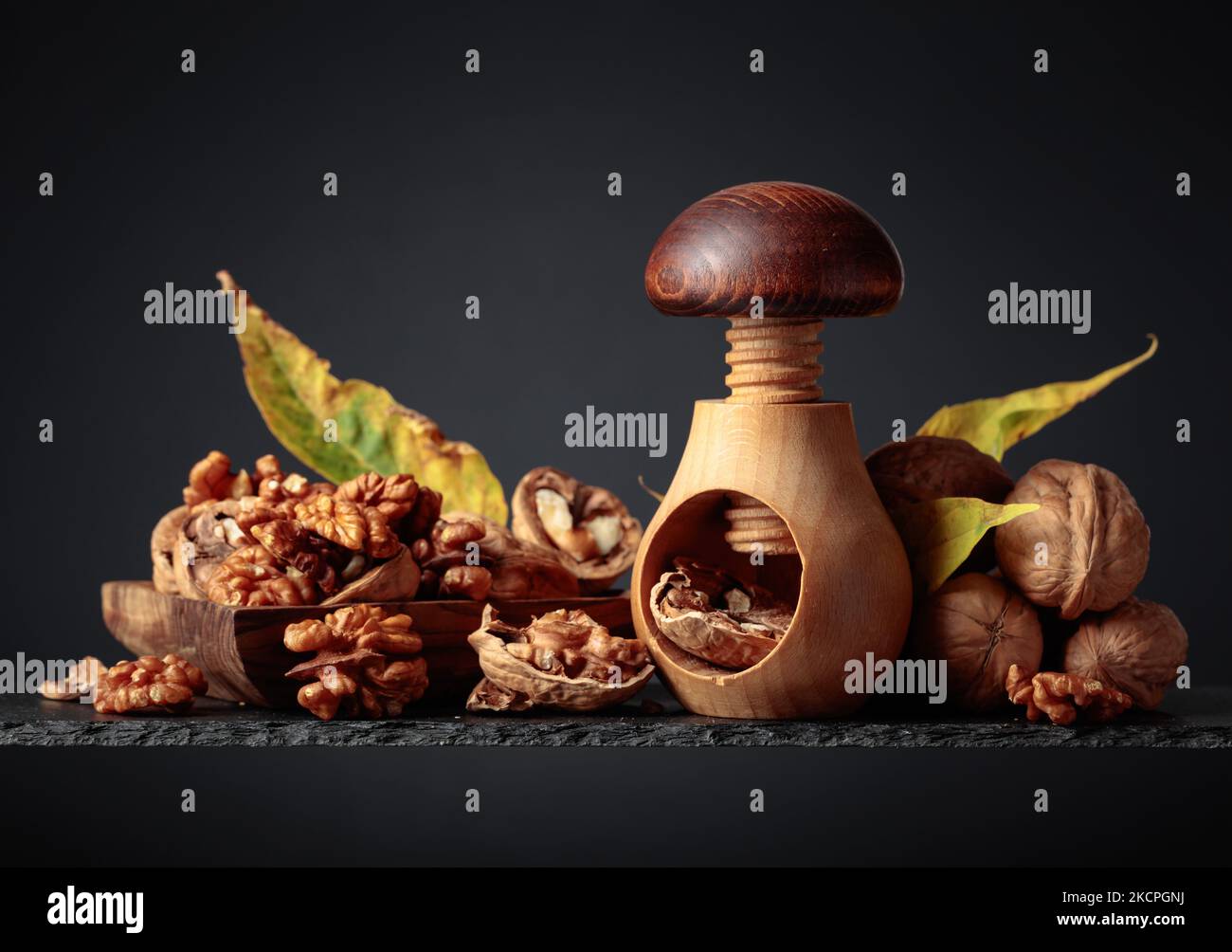 Walnuts on a black background. Copy space Stock Photo - Alamy