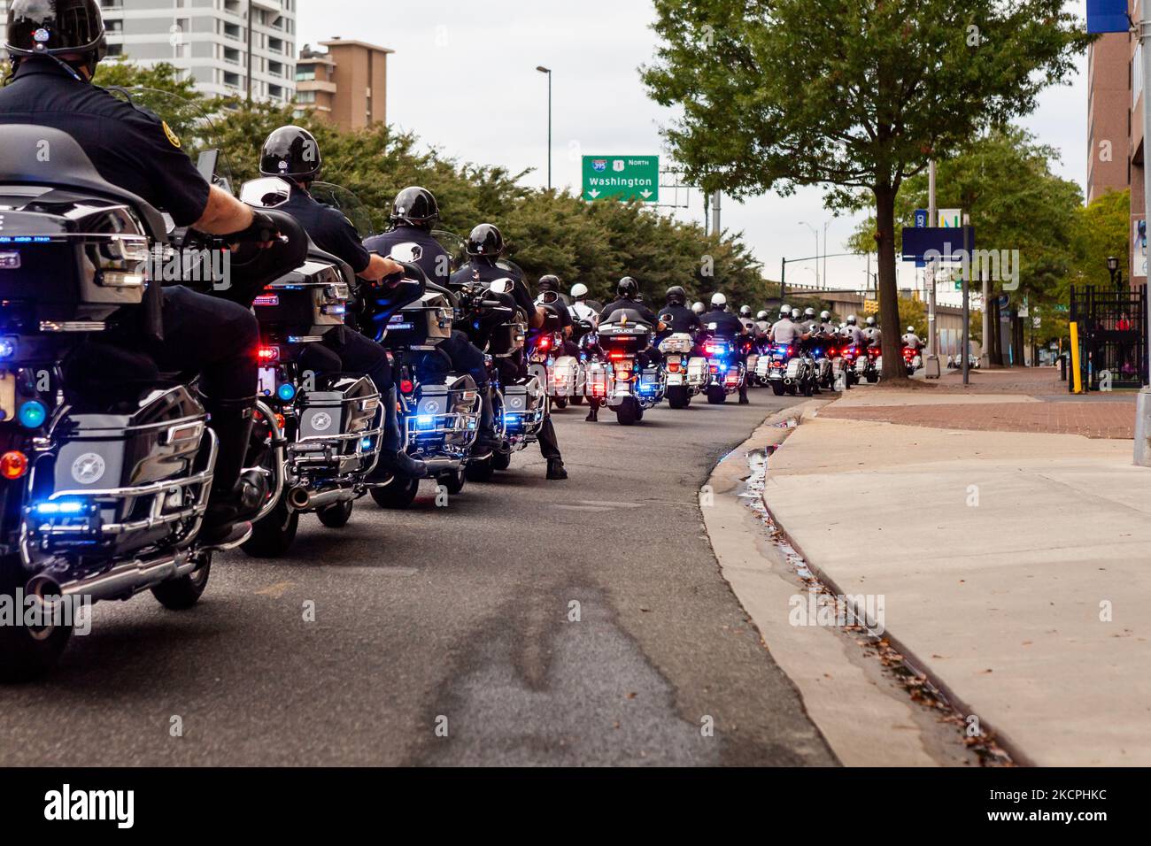 Dozens of motorcycle officers escort families of police who have been ...