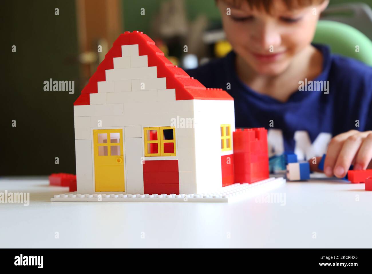 Symbol image: Boy builds a house with building blocks (Model released ...