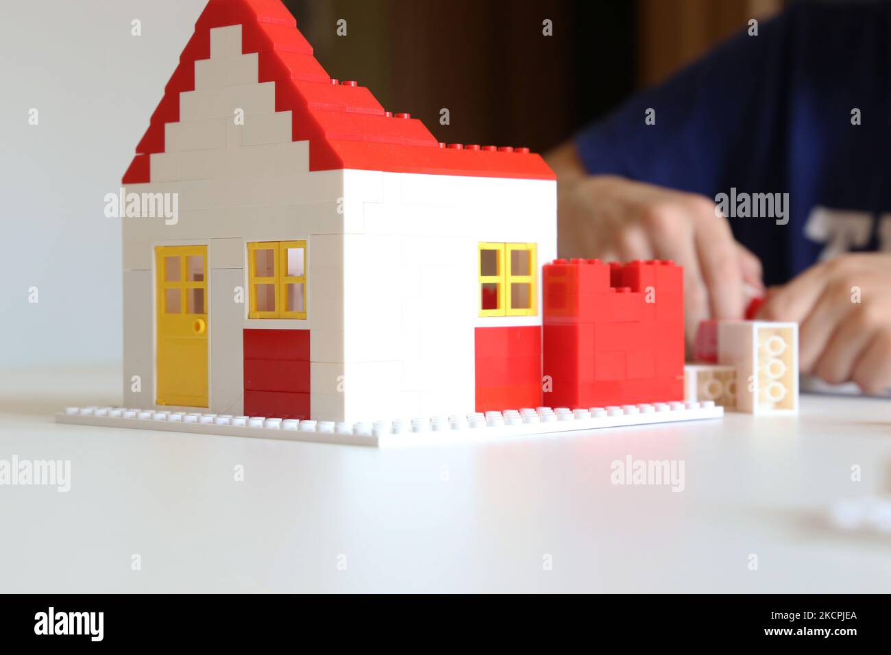 Symbol image: Boy builds a house with building blocks (Model released ...