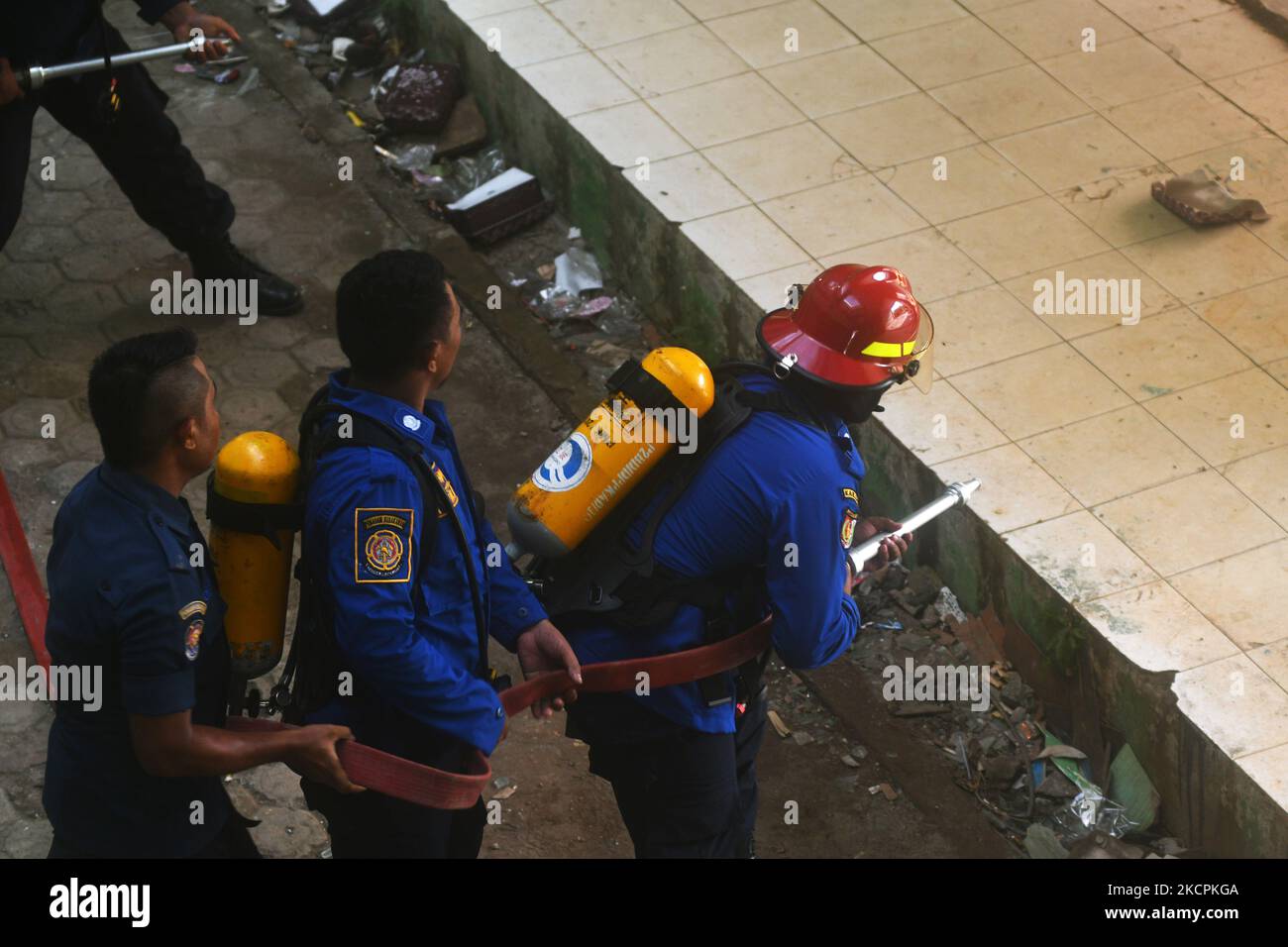 Firefighters carry out an exercise in handling and assisting a high ...