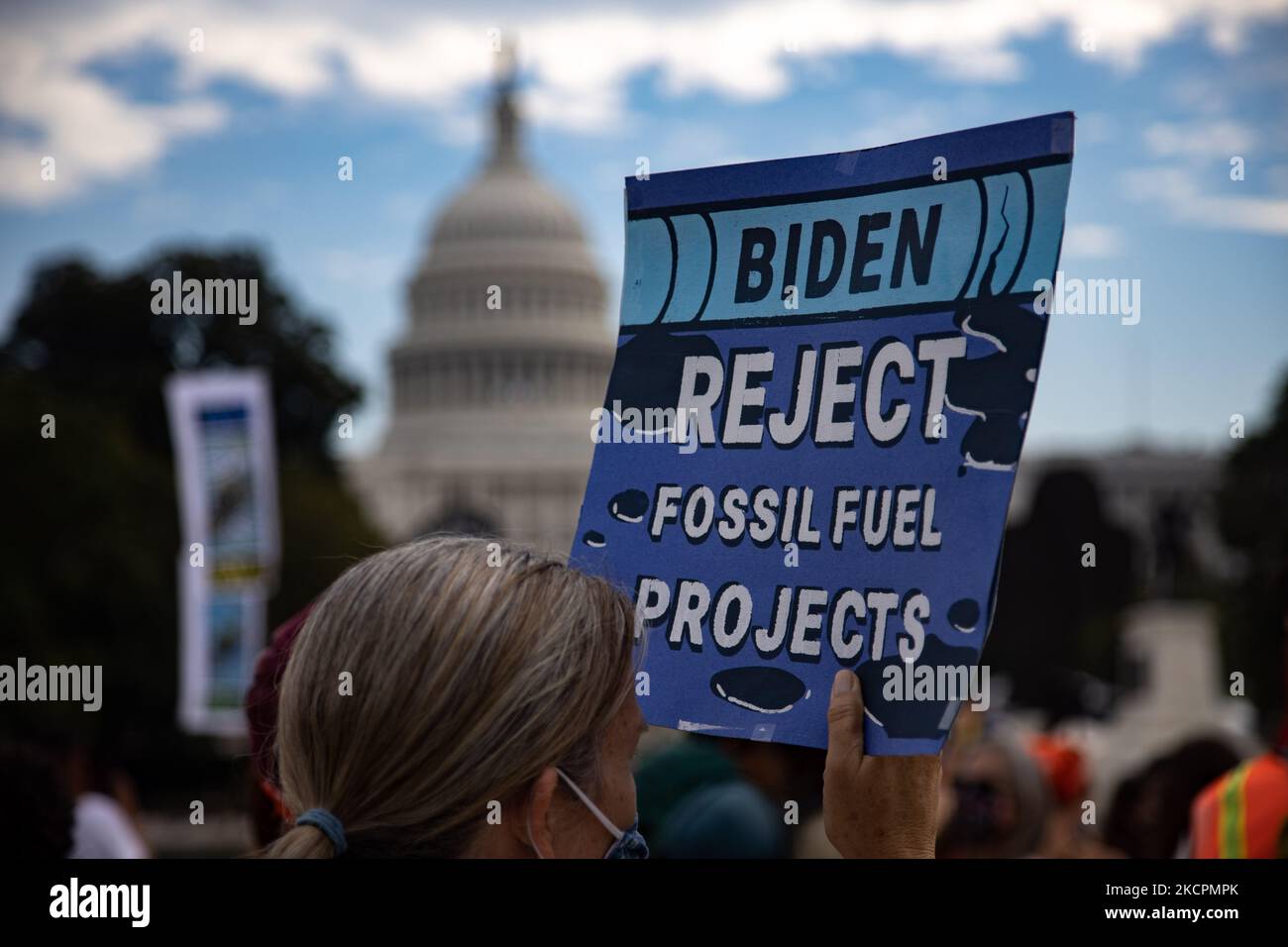 Environmental activists march to the U.S. Capitol on October 15, 2021 ...