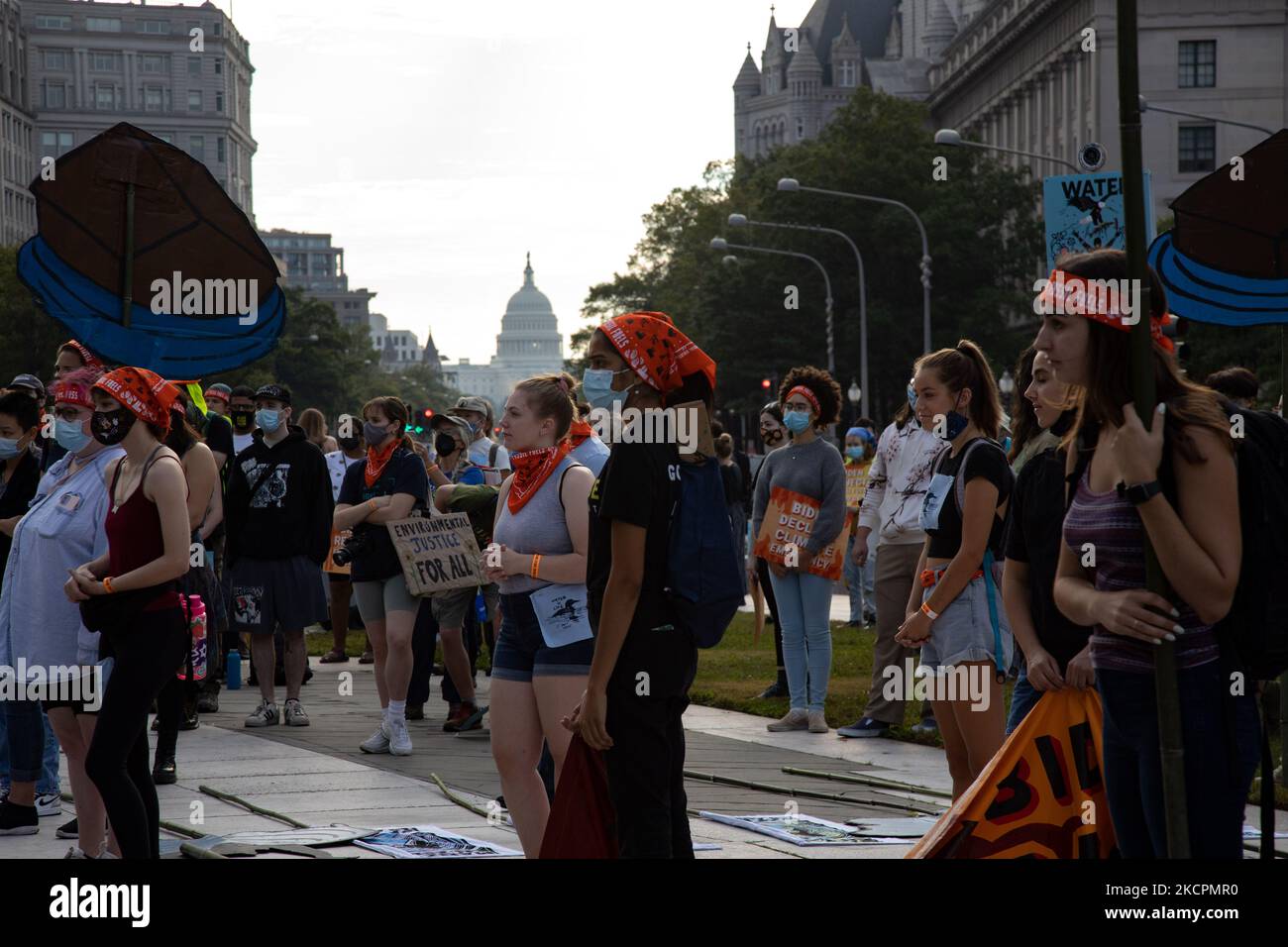 Environmental activists march to the U.S. Capitol on October 15, 2021 ...