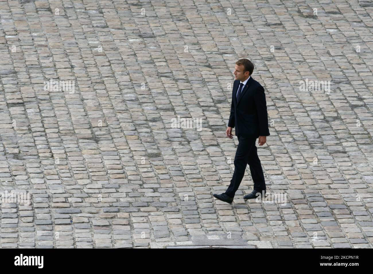 French President Emmanuel Macron pays tribute in front of the coffin of ...