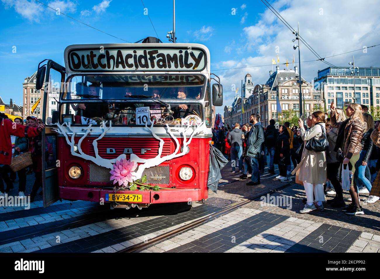 People are dancing behind one of the trucks during the colorful ADEV ...