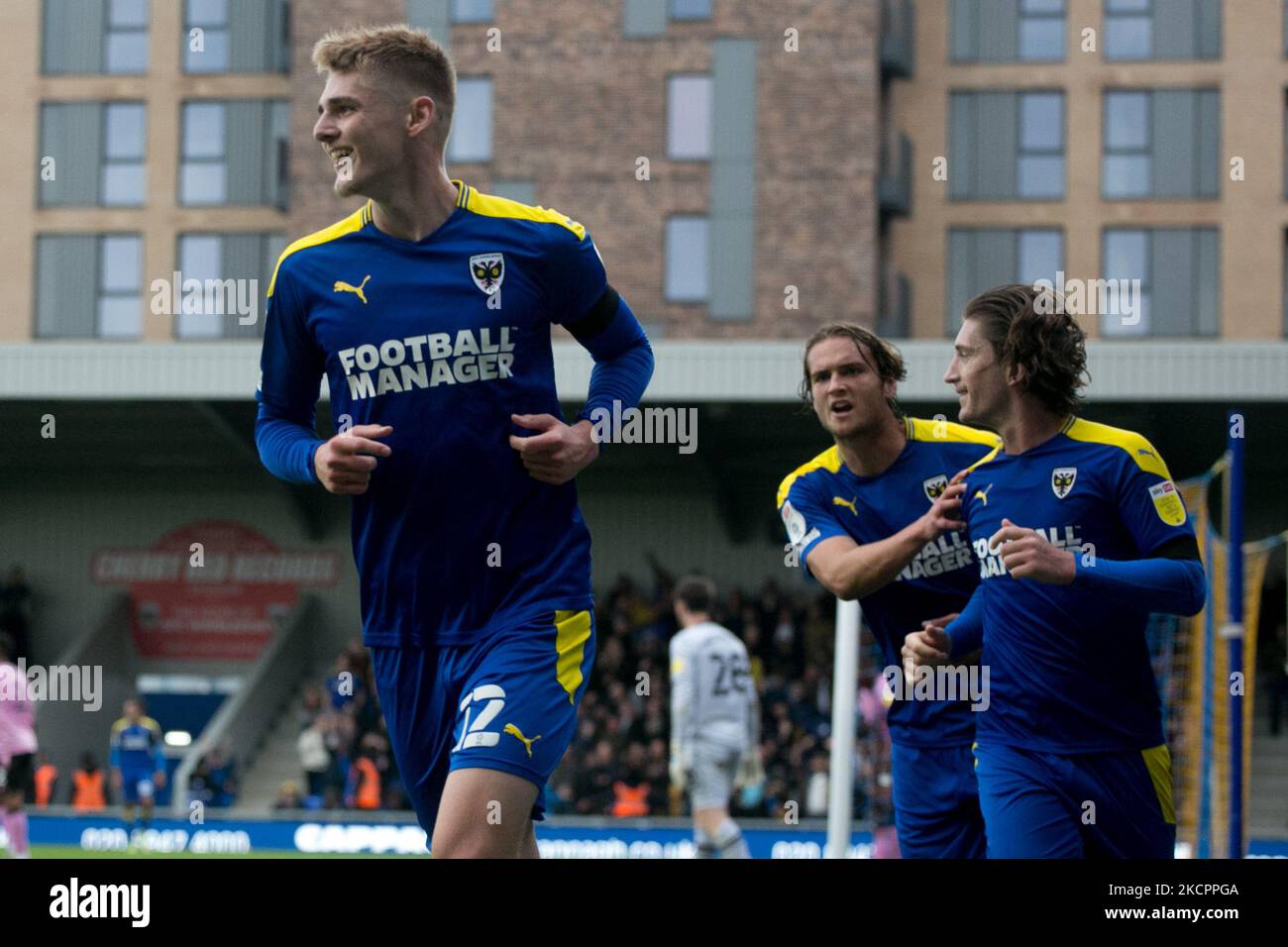 Jack Rudoni of AFC Wimbledon celebrates after scoring during the Sky ...