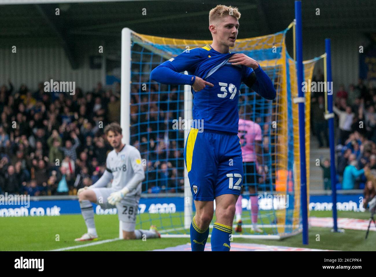 Jack Rudoni of AFC Wimbledon celebrates after scoring during the Sky ...