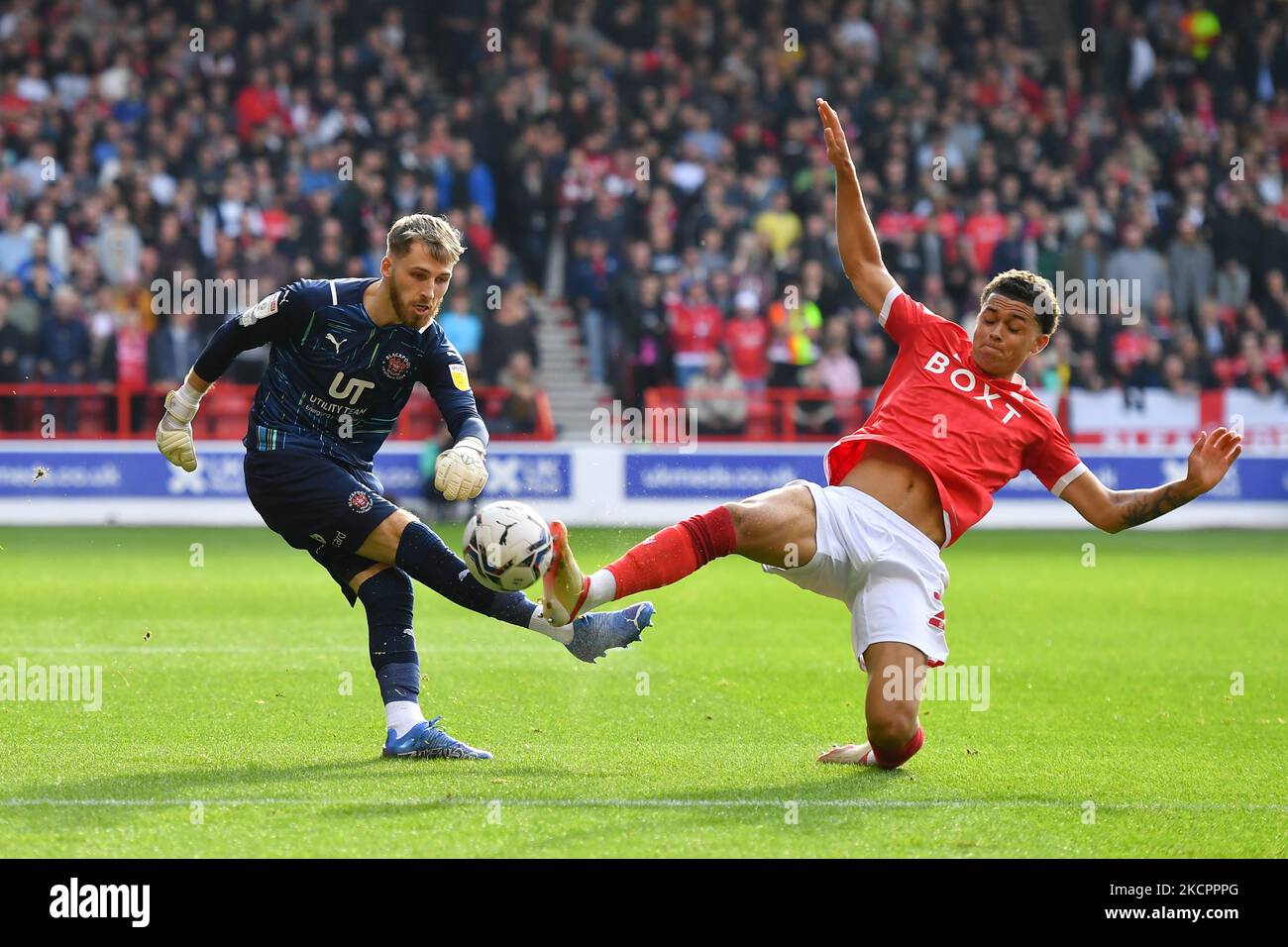 Brennan Johnson of Nottingham Forest tackles Daniel Grimshaw of ...