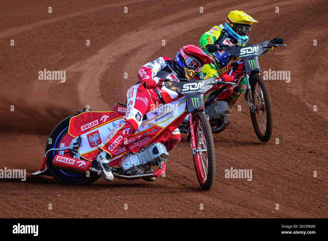 Bartosz Zmarzlik of Poland (Red) outside Max Fricke of Australia ...