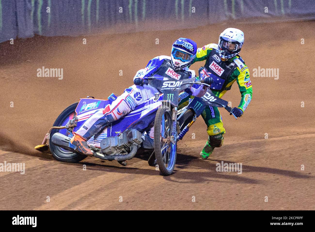 Jason Doyle of Australia (White) locks up behind Dmitri Berge of France ...