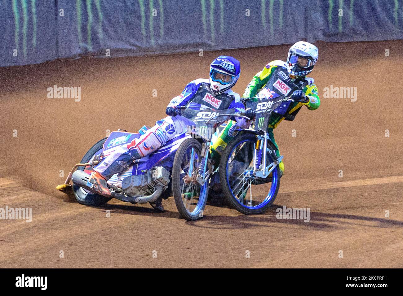 Jason Doyle of Australia (White) locks up behind Dmitri Berge of France ...