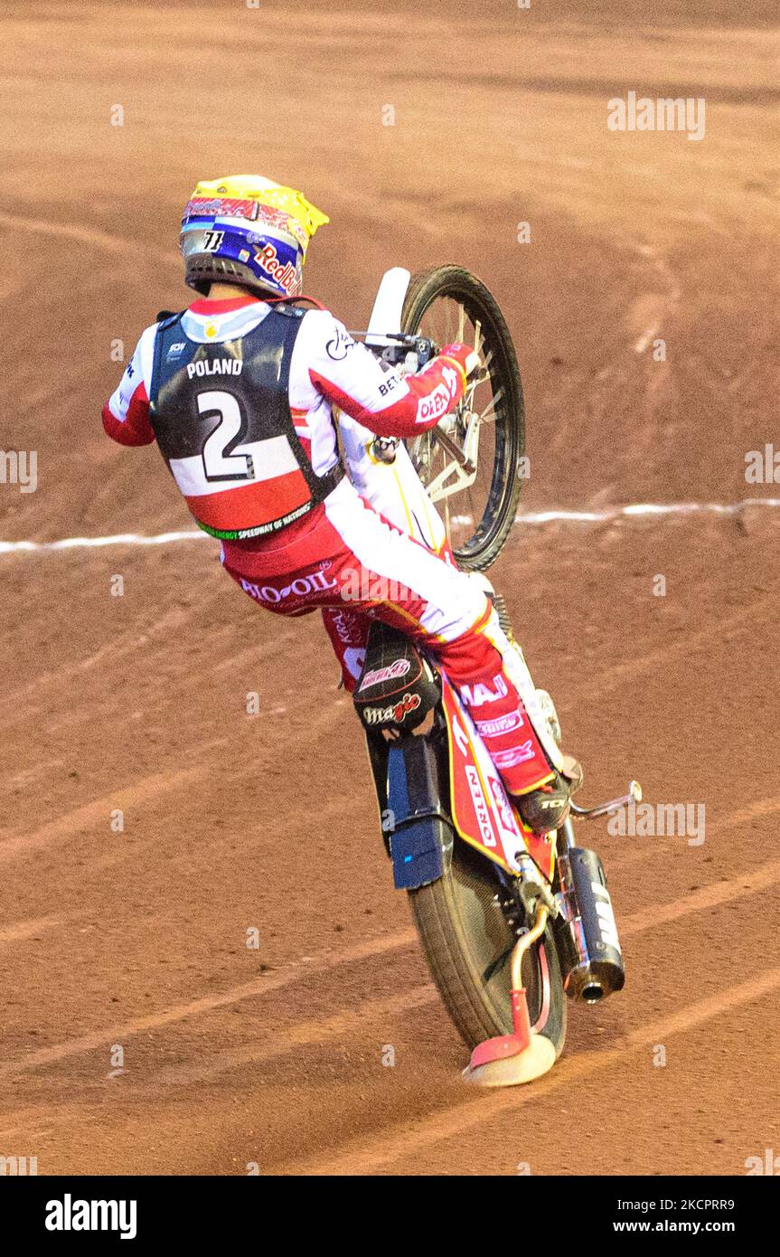Maciej Janowski of Poland celebrates with a wheelie during the Monster ...