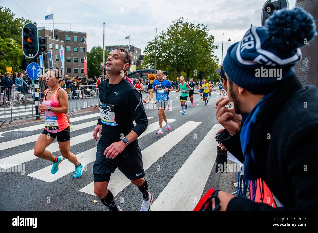Runners passing by the Rijksmuseum during the last kilometers of the ...