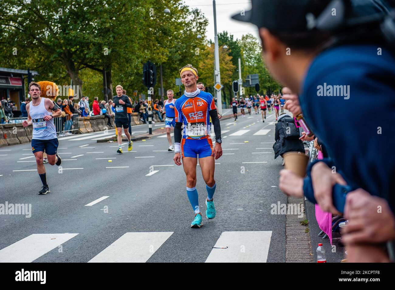 A runner is exhausted during the last kilometers of the TCS Amsterdam ...
