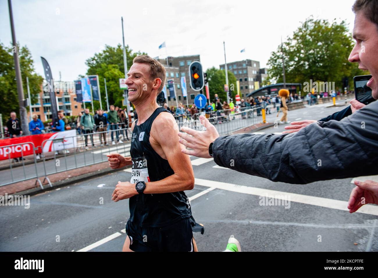 A spectator is cheering one of the runner, during the TCS Amsterdam ...