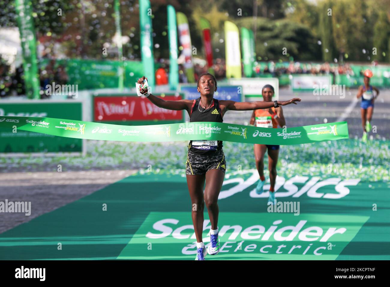 Kenya's Ethiopia's Tigist Memuye celebrates on the finish line as she ...