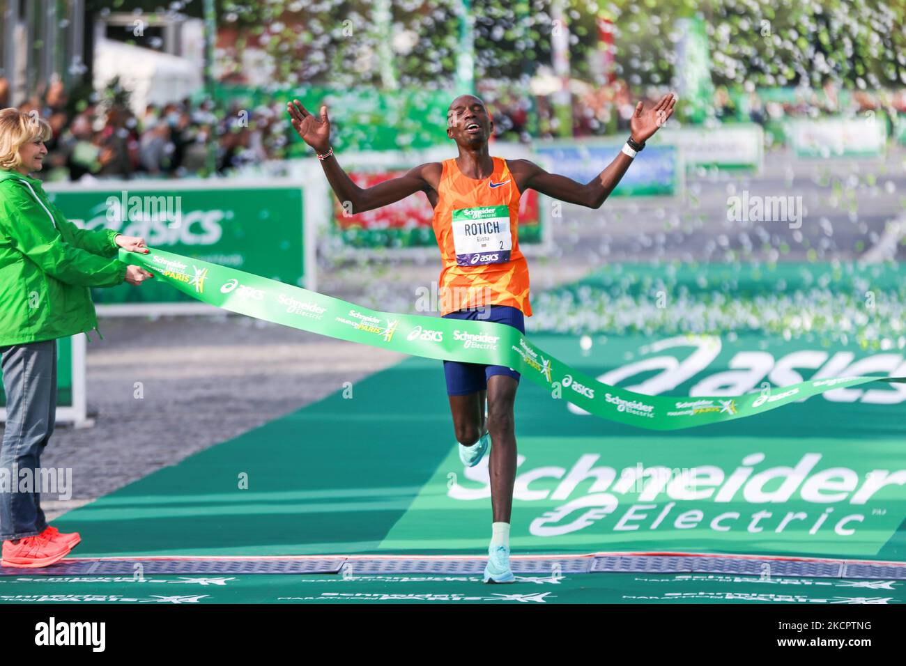Kenya's Elisha Rotich celebrates on the finish line as he wins the men ...