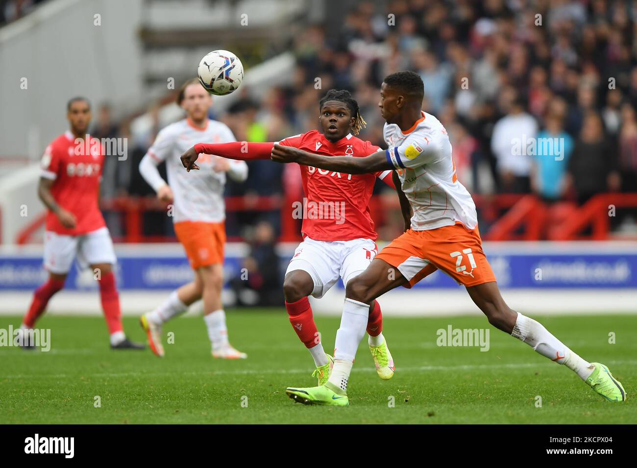 Alex Mighten of Nottingham Forest battles with Marvin Ekpiteta of ...