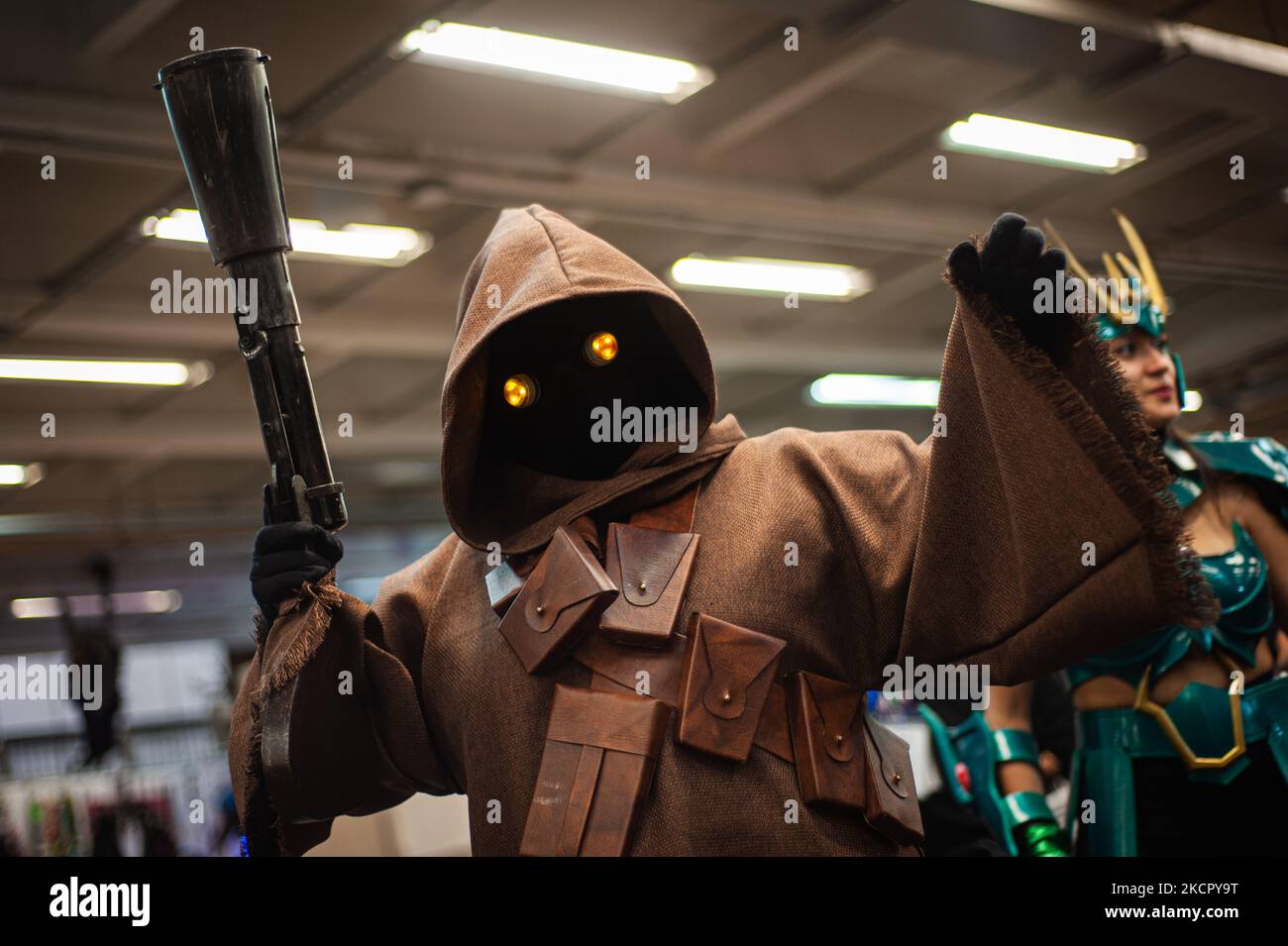 A Star Wars fan wears a costume of a JAWA character during the fourth ...