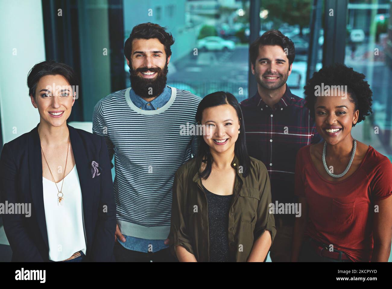 Weve become known as the team of bold creatives. Portrait of a group of ...