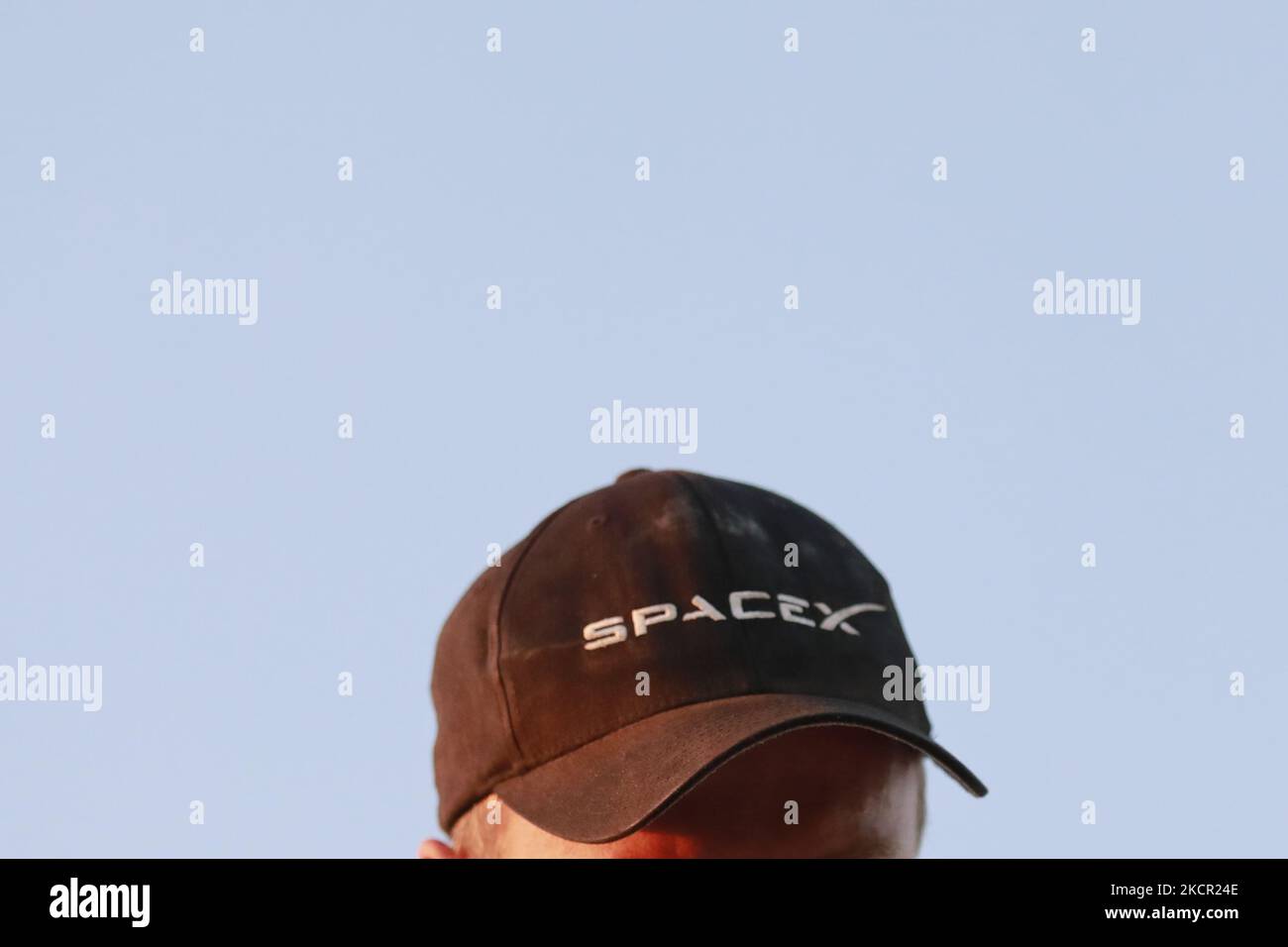 A SpaceX employee's hat as he waits for S20's static fire test on ...