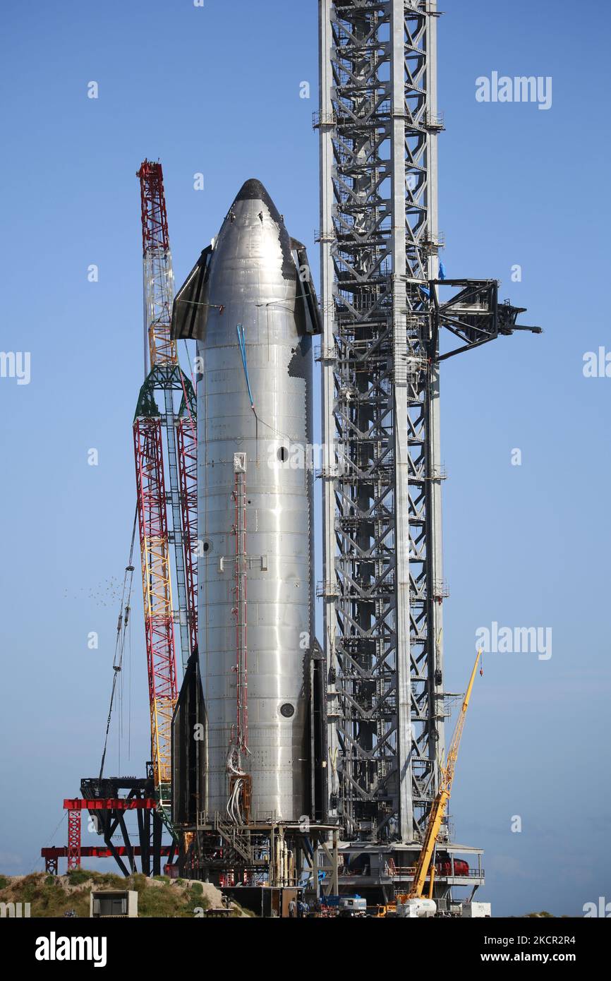 Starship 20 stands in font of the nearly completed launch tower on ...