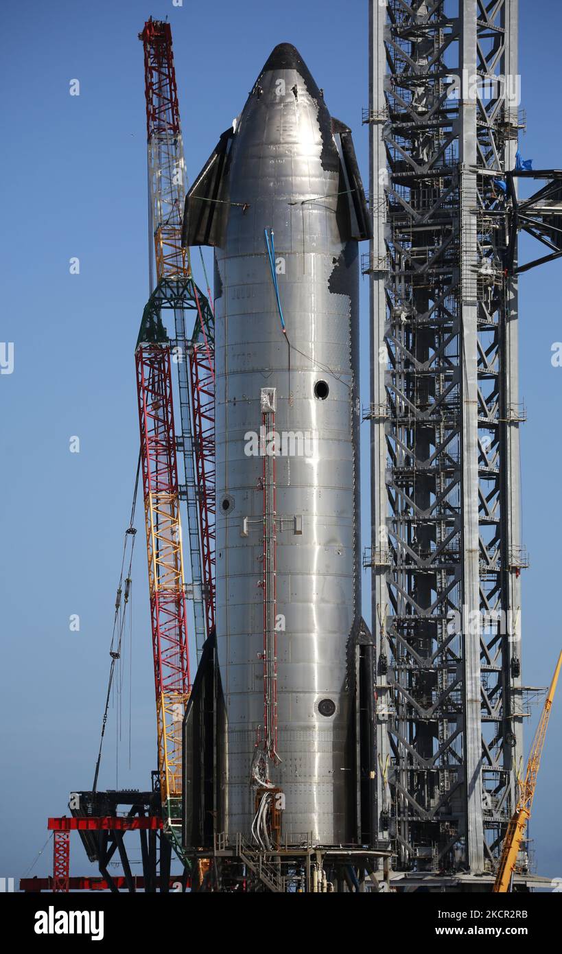 Starship 20 stands in font of the nearly completed launch tower on ...