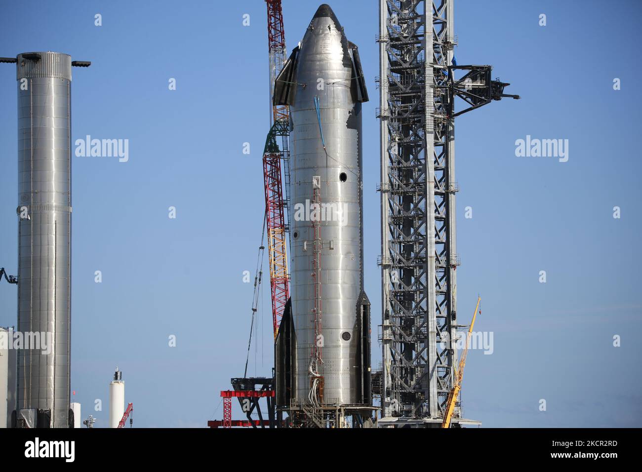 Starship 20 stands in font of the nearly completed launch tower on ...