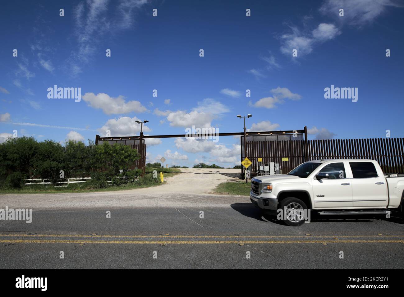 An opened gate in the U.S.-Mexican border wall in Cameron County, Texas ...