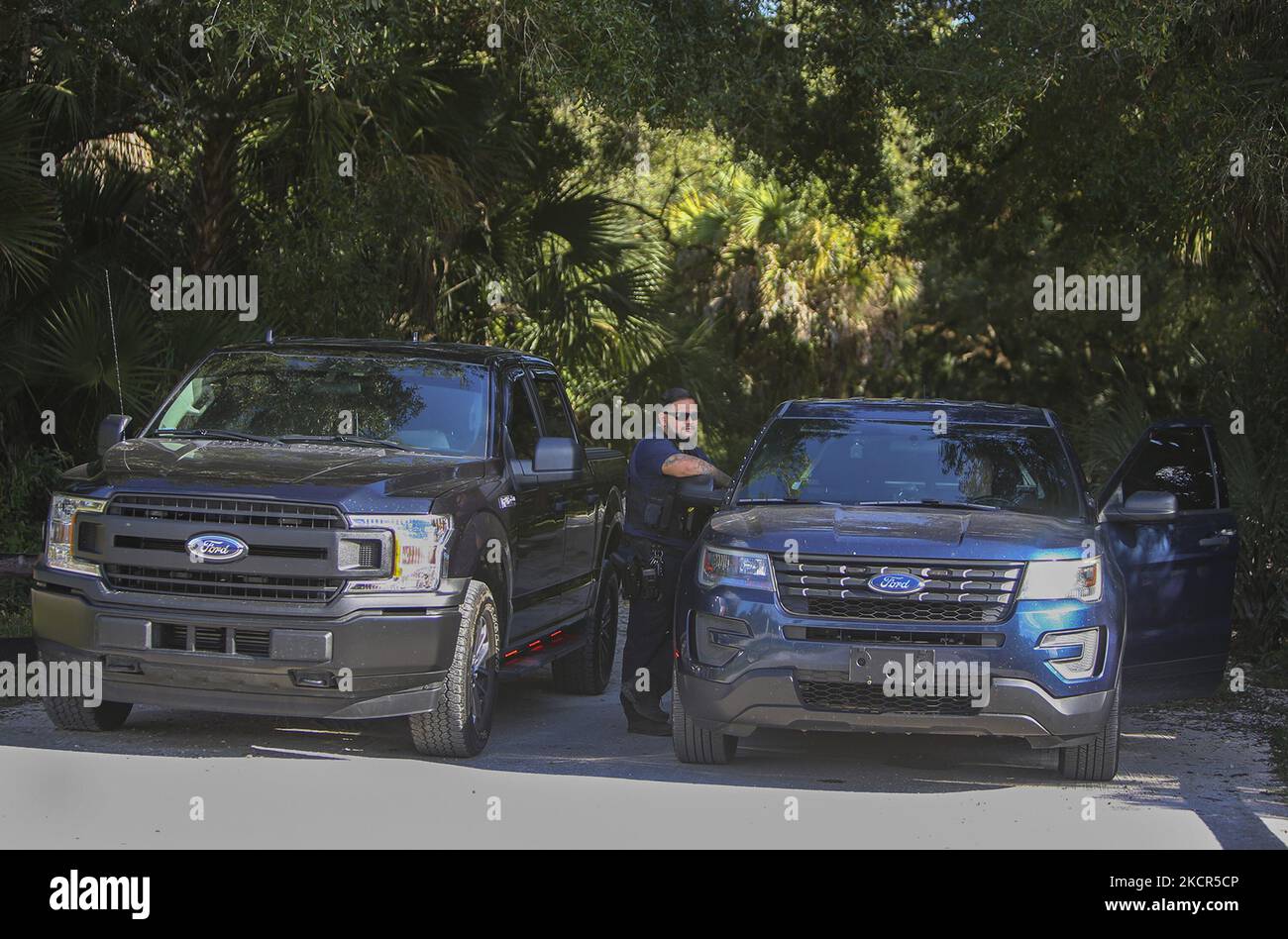 North Port Police Officer Steven Cambria patrols the entrance to ...