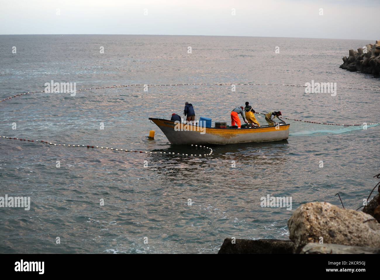 Palestinian fishermen fish in the sea port of Gaza in Gaza City, on ...
