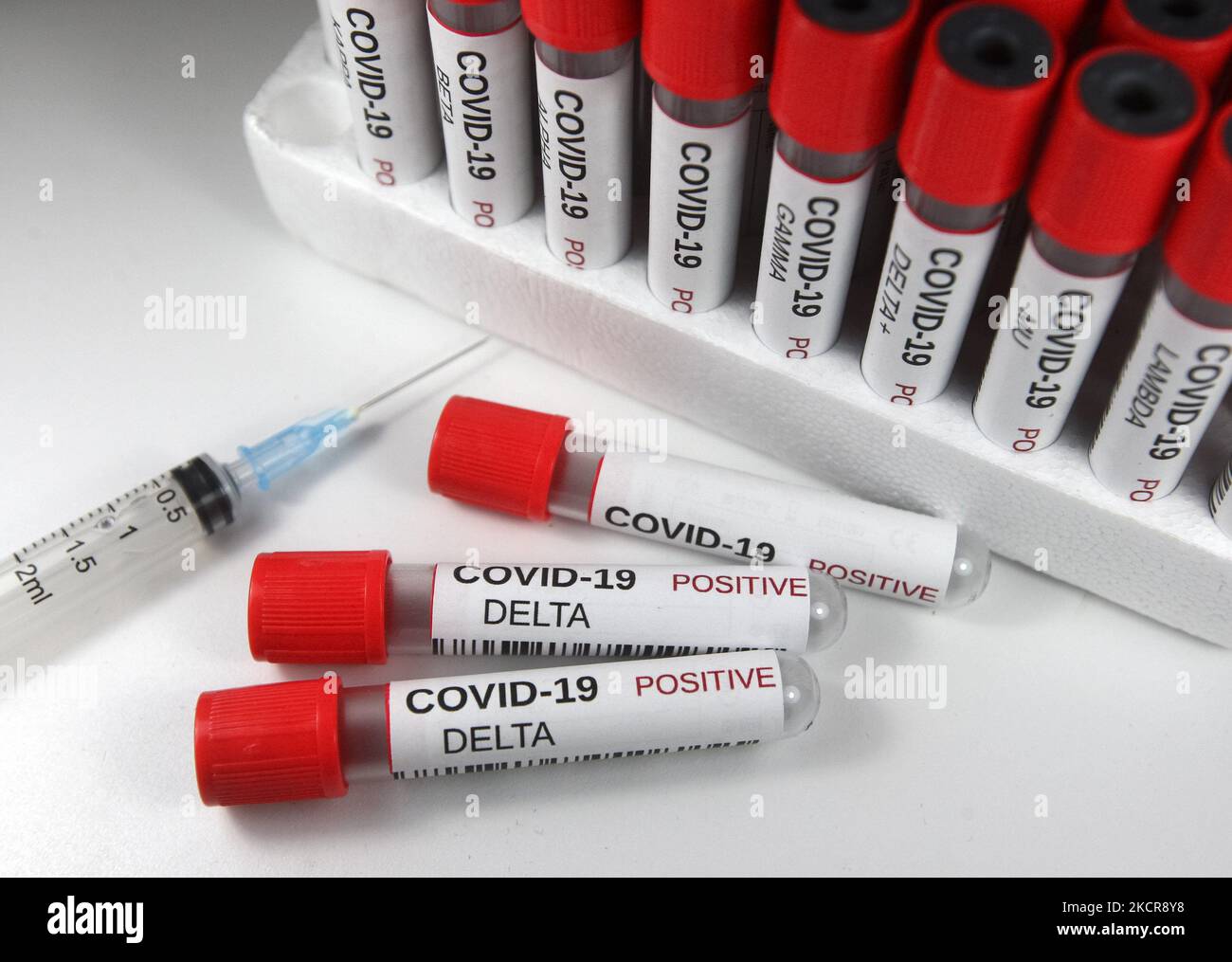 Test sample tubes labelled 'COVID-19 Delta,Delta + (plus),Alpha,Gamma ...
