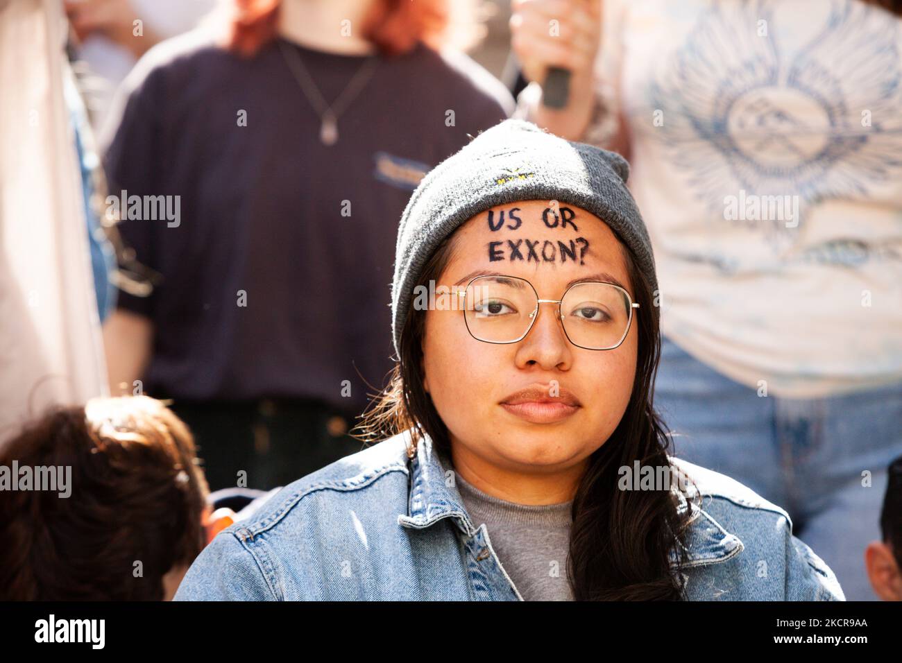 Hunger strikers hold signs with the reason(s) they are striking at a ...