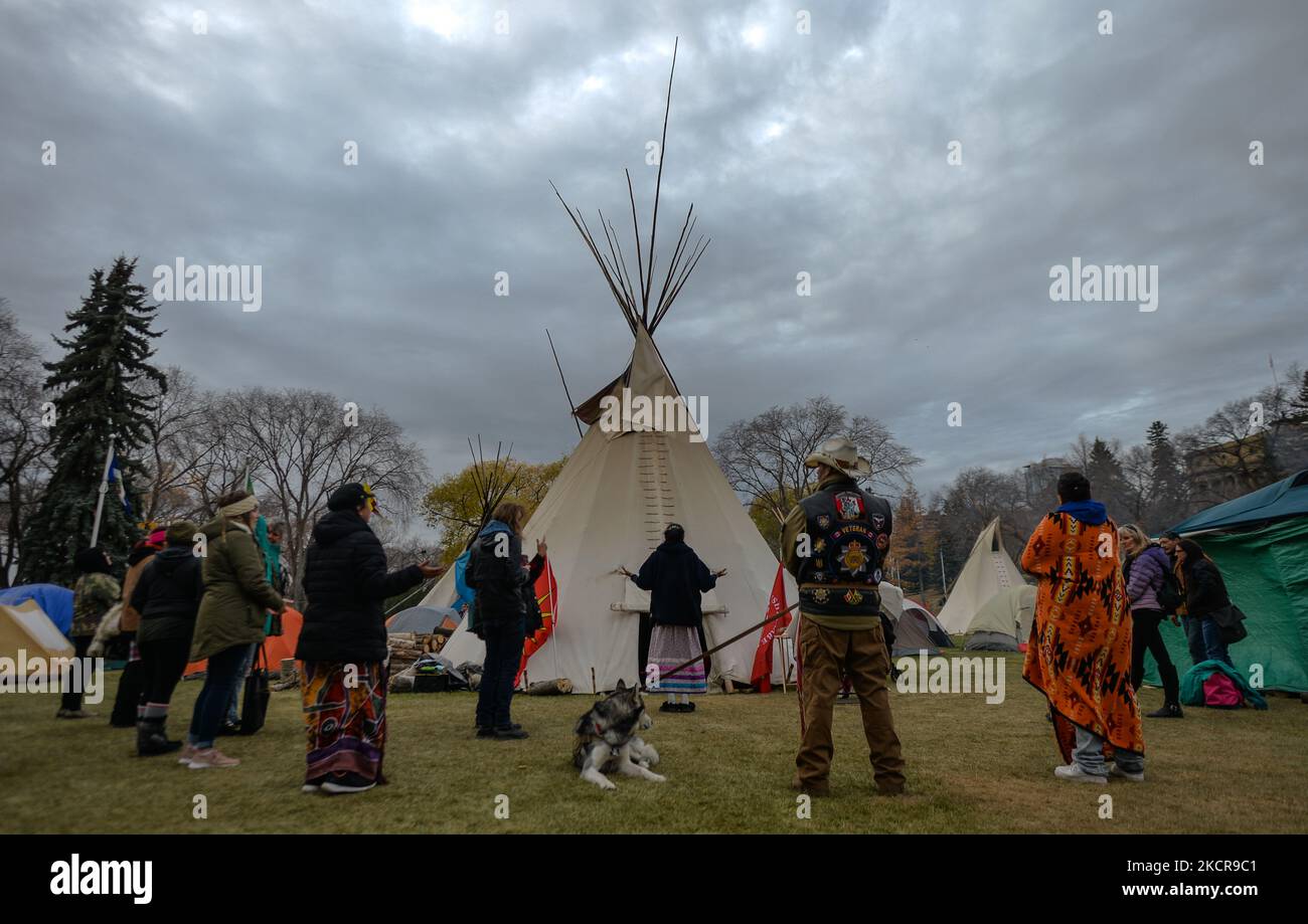 People seen during a prayer ceremony in a 'sit-in' camp that consists ...
