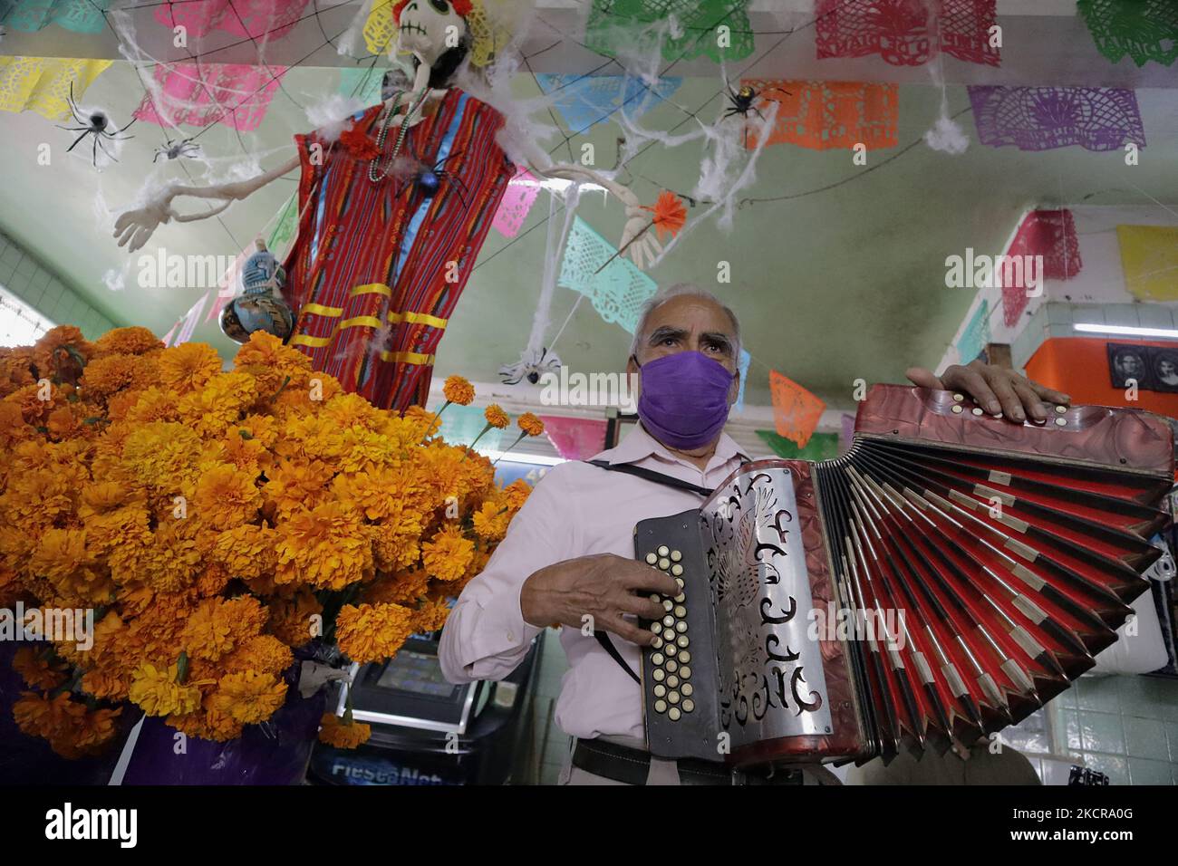 A musician plays an accordion inside the pulqueria El Templo de Diana ...