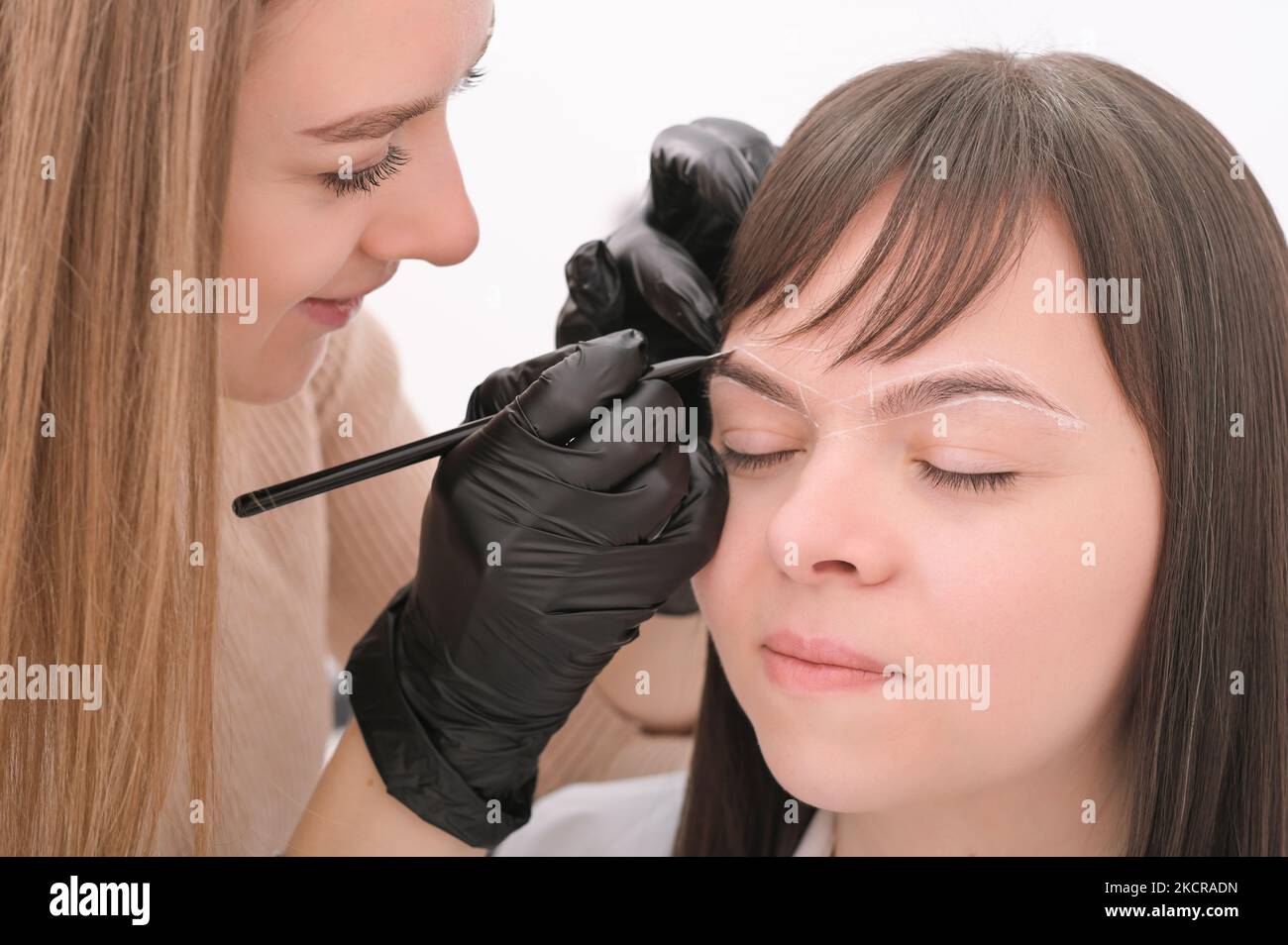 Brow marking and measuring before microblading or henna tattoo close-up ...