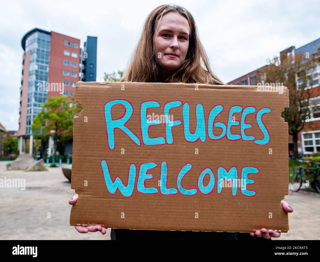 A Dutch woman is holding a placard in support of refugees, during a ...