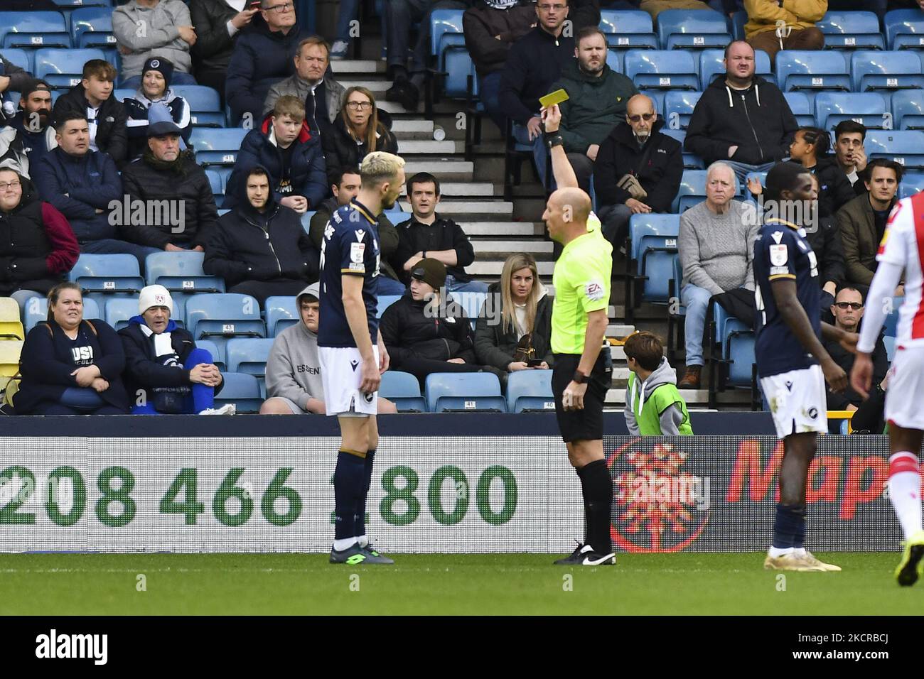 Scott Mallone of Millwall is shown a yellow card by the referee Andy ...