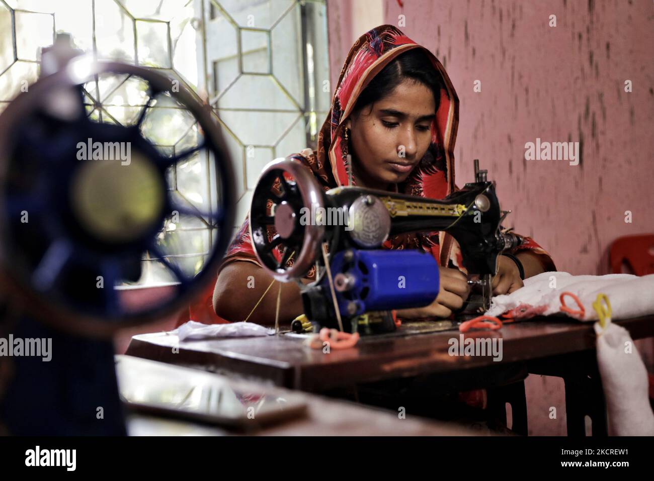 Women work in a low cost sanitary napkin factory in Shatkhira ...