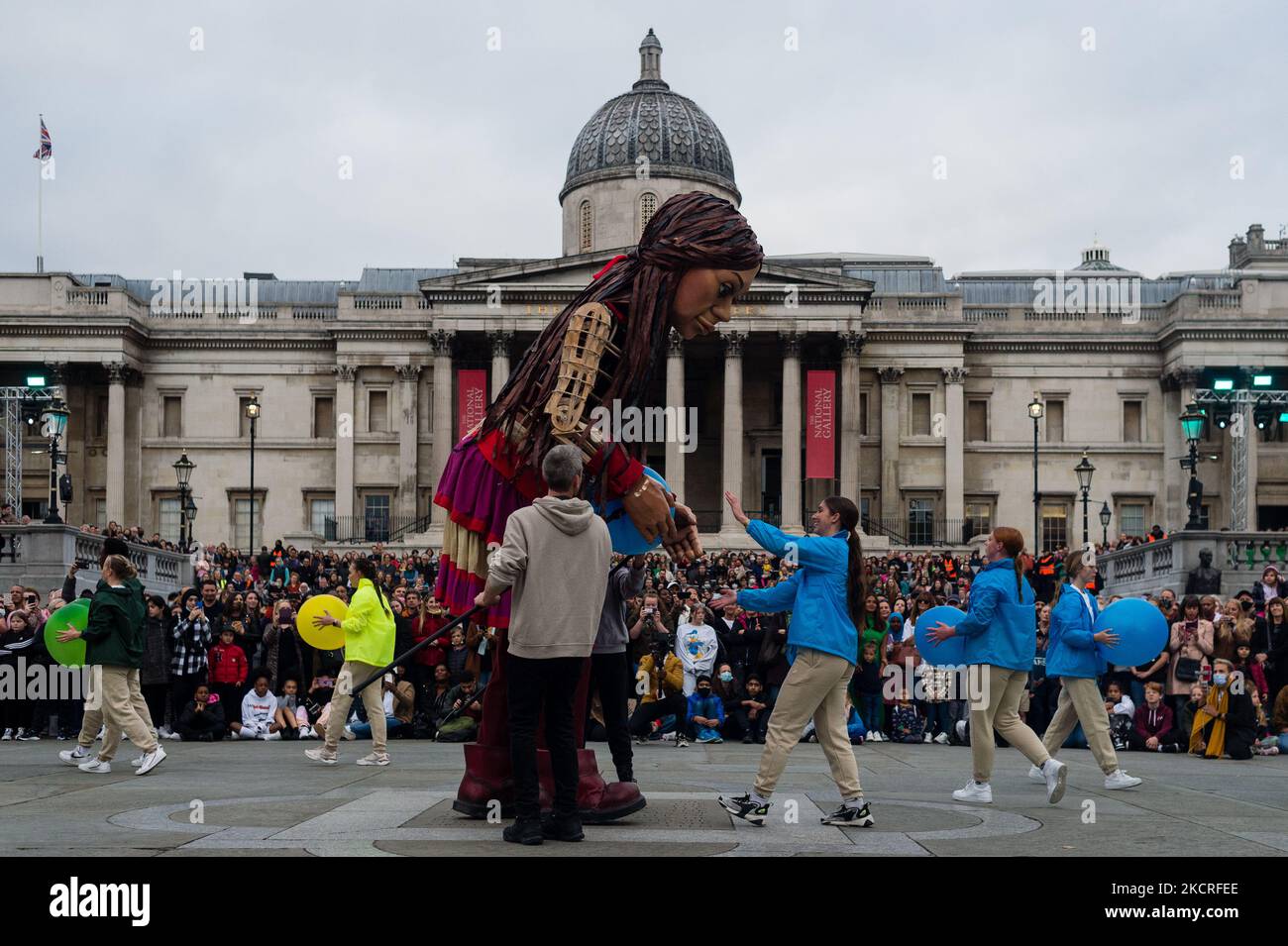 'Little Amal', a giant puppet depicting a Syrian refugee girl, performs ...