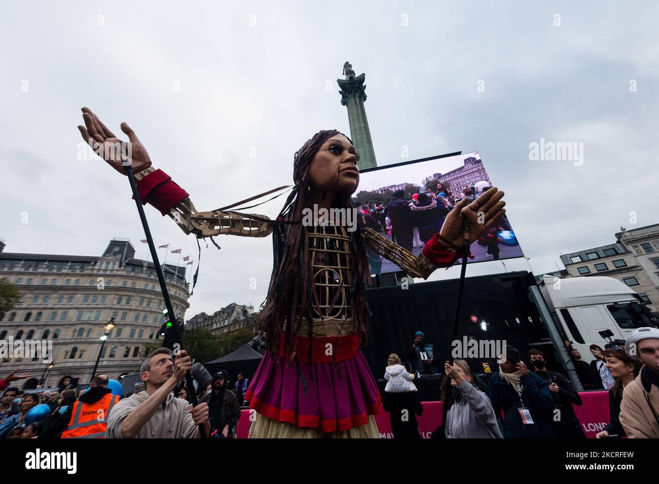 'Little Amal', a giant puppet depicting a Syrian refugee girl, performs ...