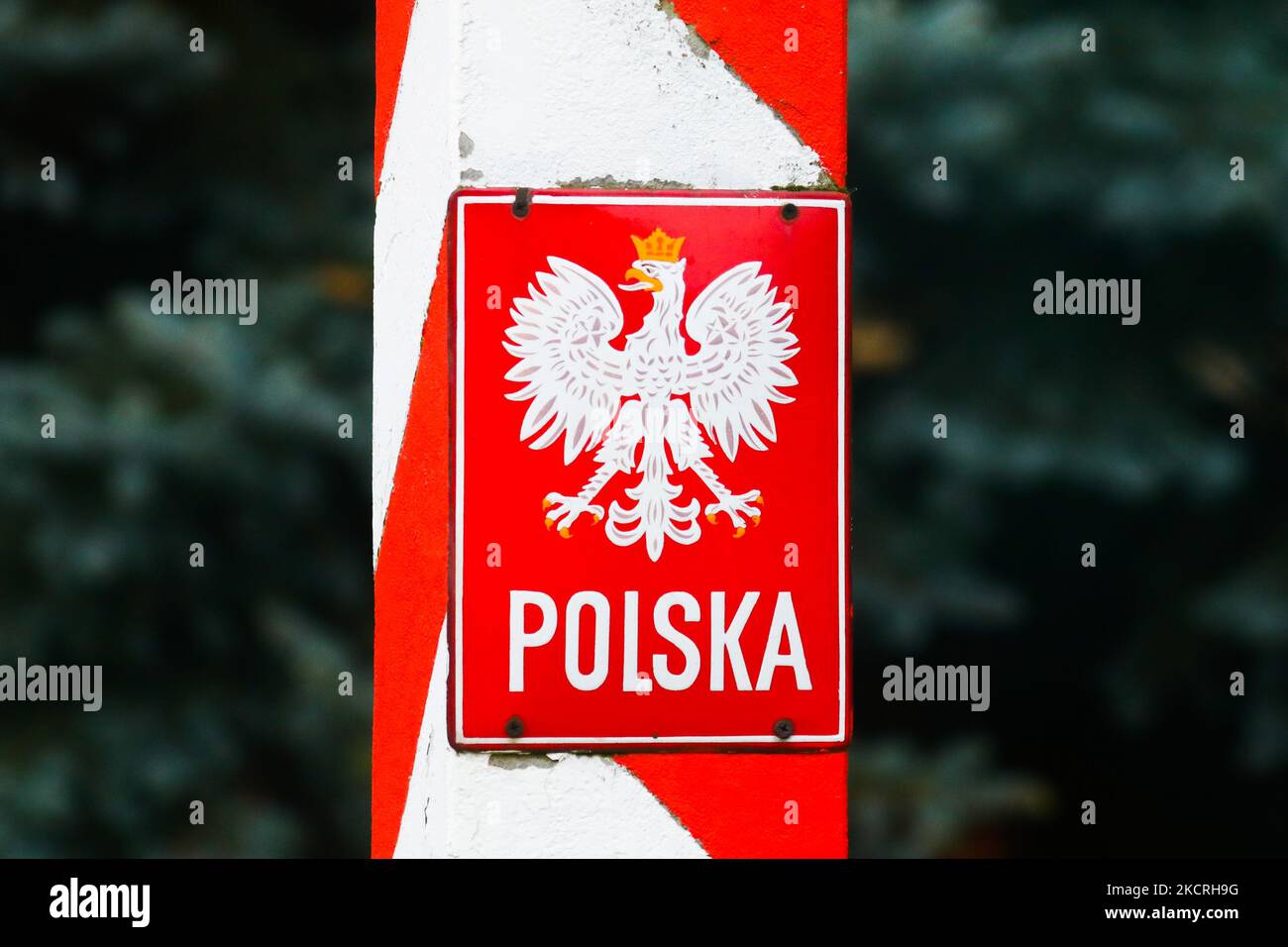 Polish border marking pole is seen in front of the border guard ...