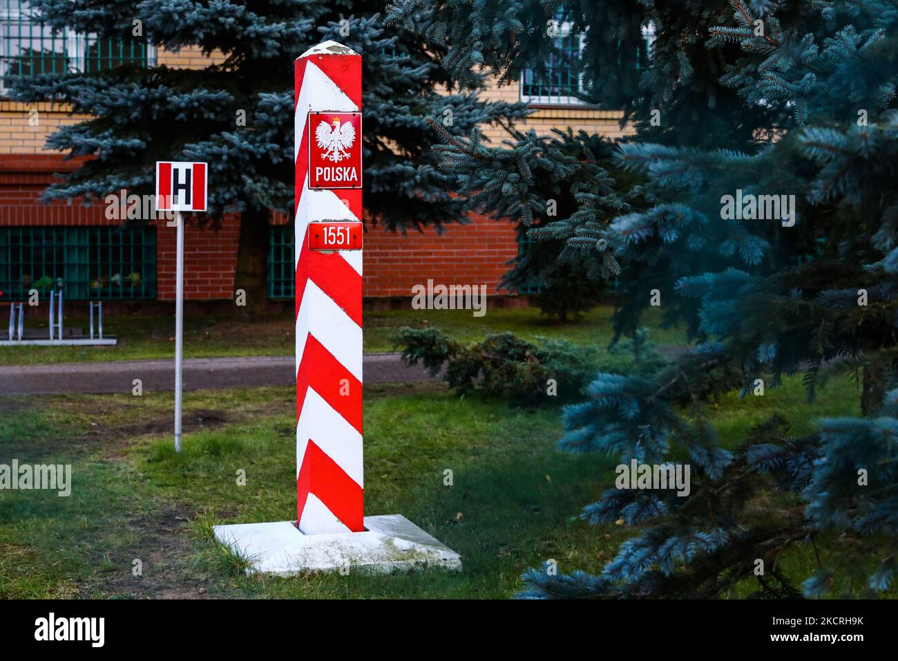 Polish border marking pole is seen in front of the border guard ...