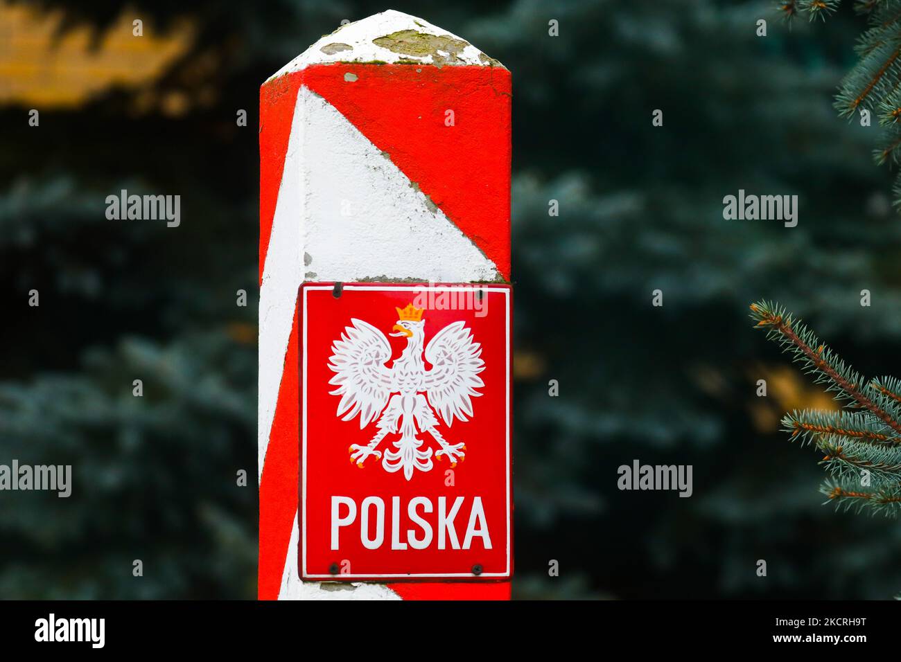 Polish border marking pole is seen in front of the border guard ...