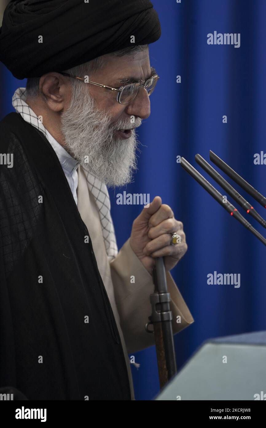 Iran's Supreme Leader Ayatollah Ali Khamenei holds a gun as he speaks ...