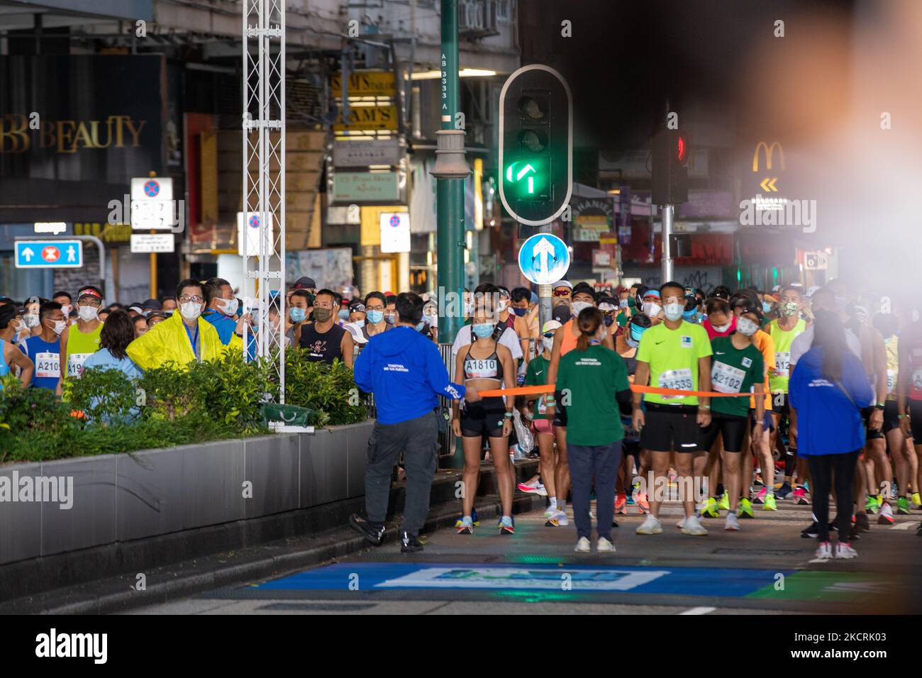 Hong Kong S.A.R. Runners at the start of the 2021 Hong Kong Marathon ...