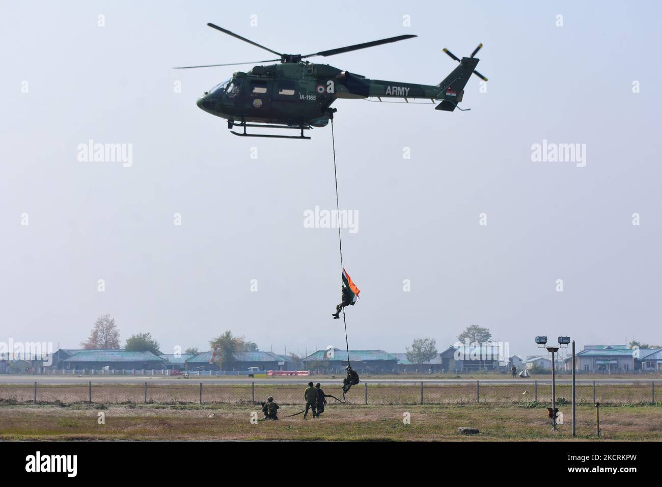 Indian paratroopers performs during a re-enactment of the Indian army's ...
